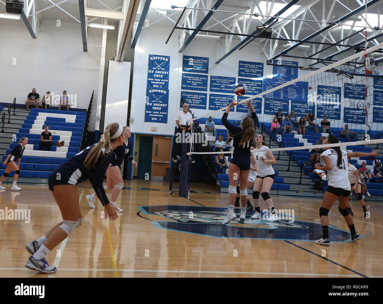 Girls high school volleyball game in a high school gym Stock Photo - Alamy