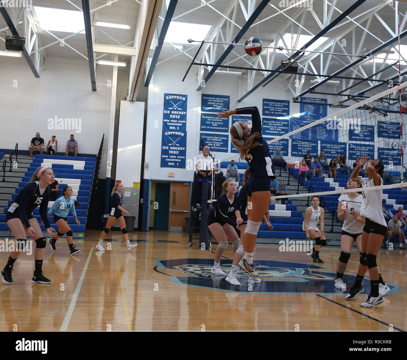 Girls high school volleyball game in a high school gym Stock Photo - Alamy