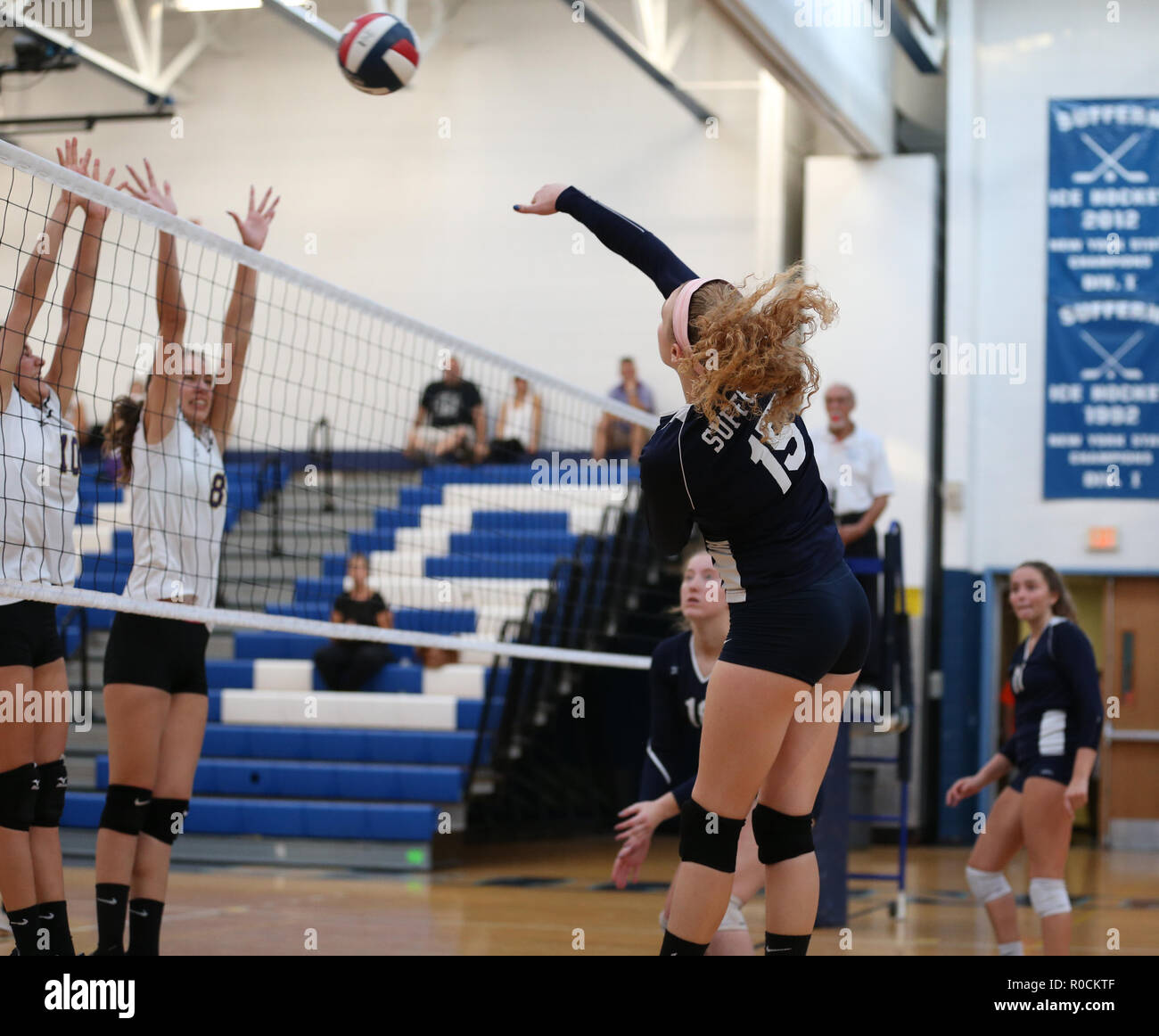 Girls high school volleyball game in a high school gym Stock Photo - Alamy