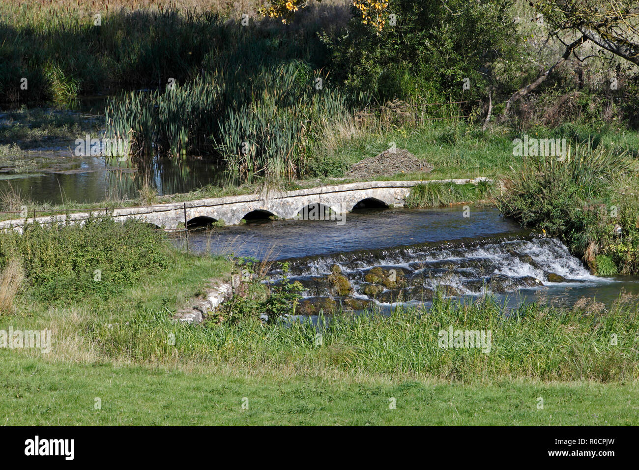 Low road bridge over the Sherborne Brook, and ford, by the Sherborne ...