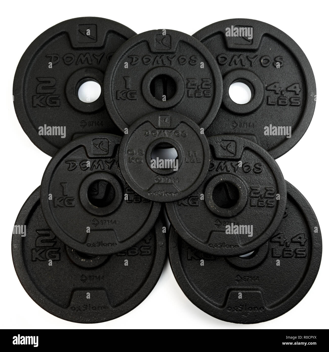 Black steel weights for dumbbells from the brand Domyos. half one and two kilogram weights Stock Photo Alamy
