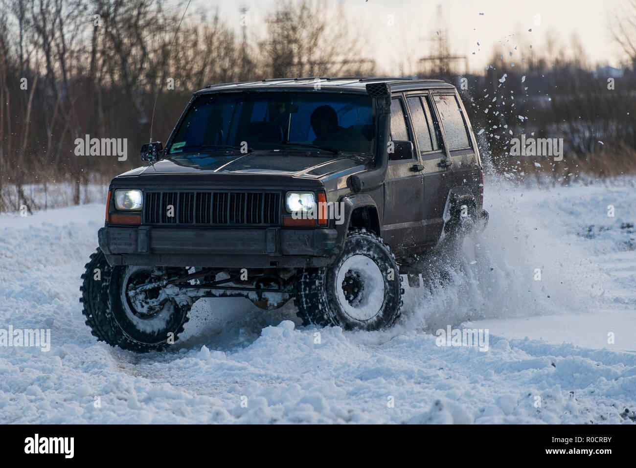 off road car overcomes the track Stock Photo - Alamy