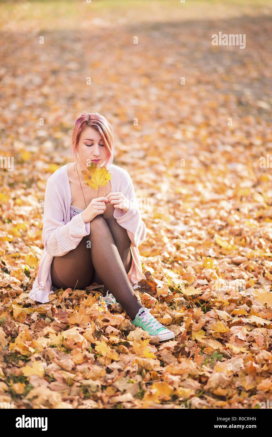 Young woman in fall park hi-res stock photography and images - Alamy