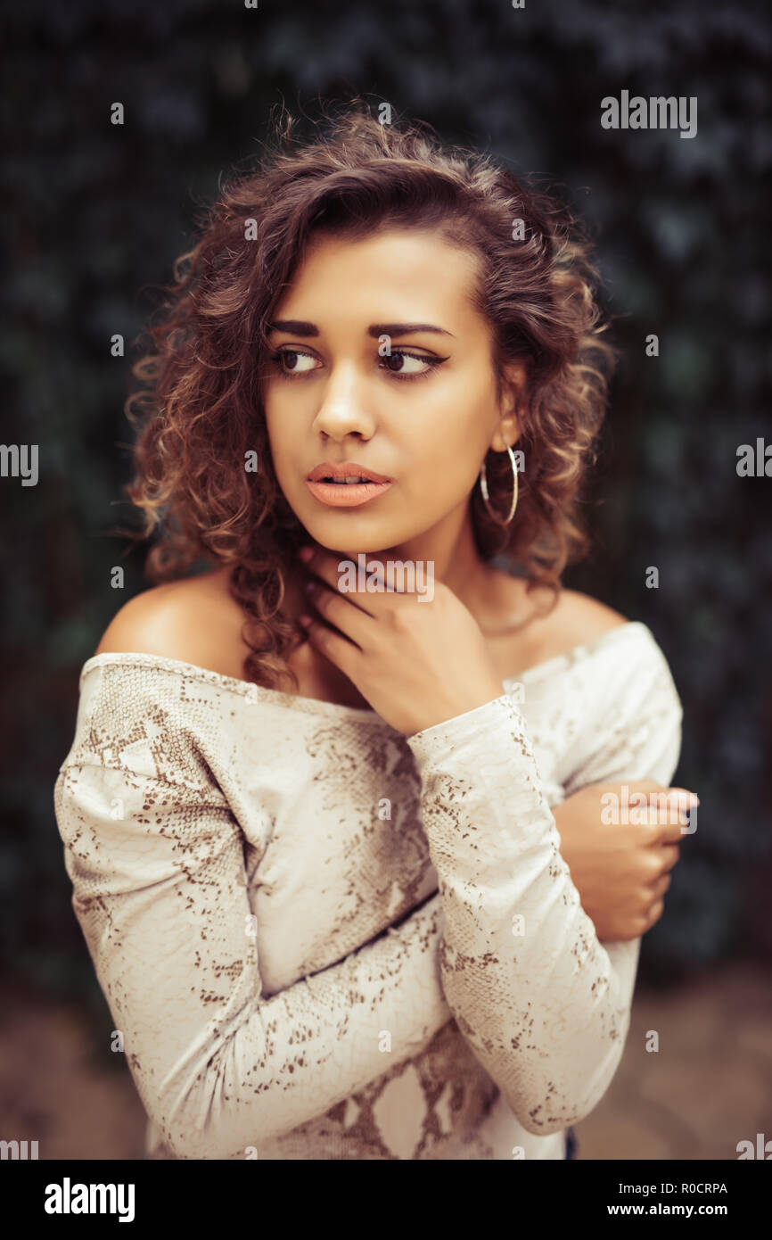 Naturally beautiful. Attractive young woman looking at camera and ...