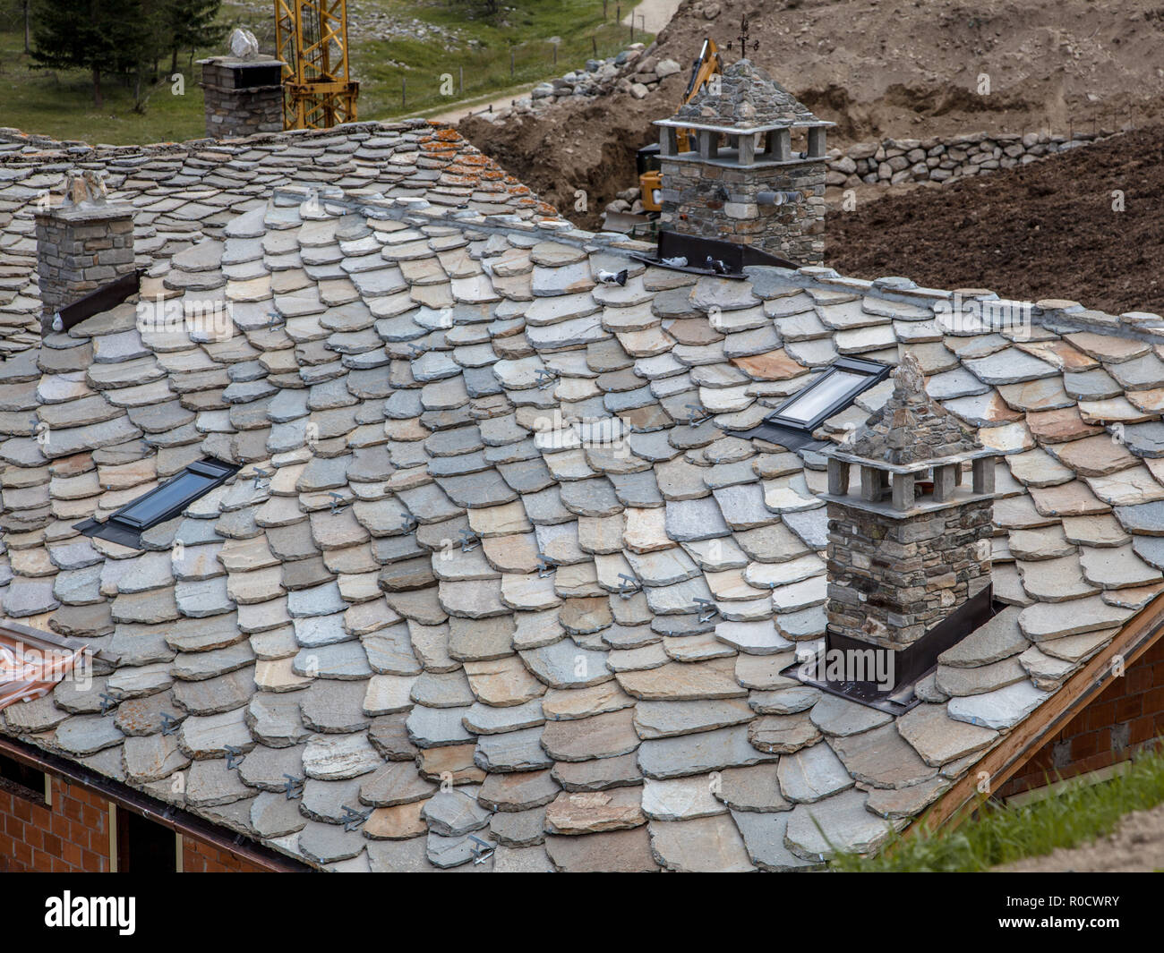 Schist Roof Tiles Being Installed on a New House Stock Photo - Alamy