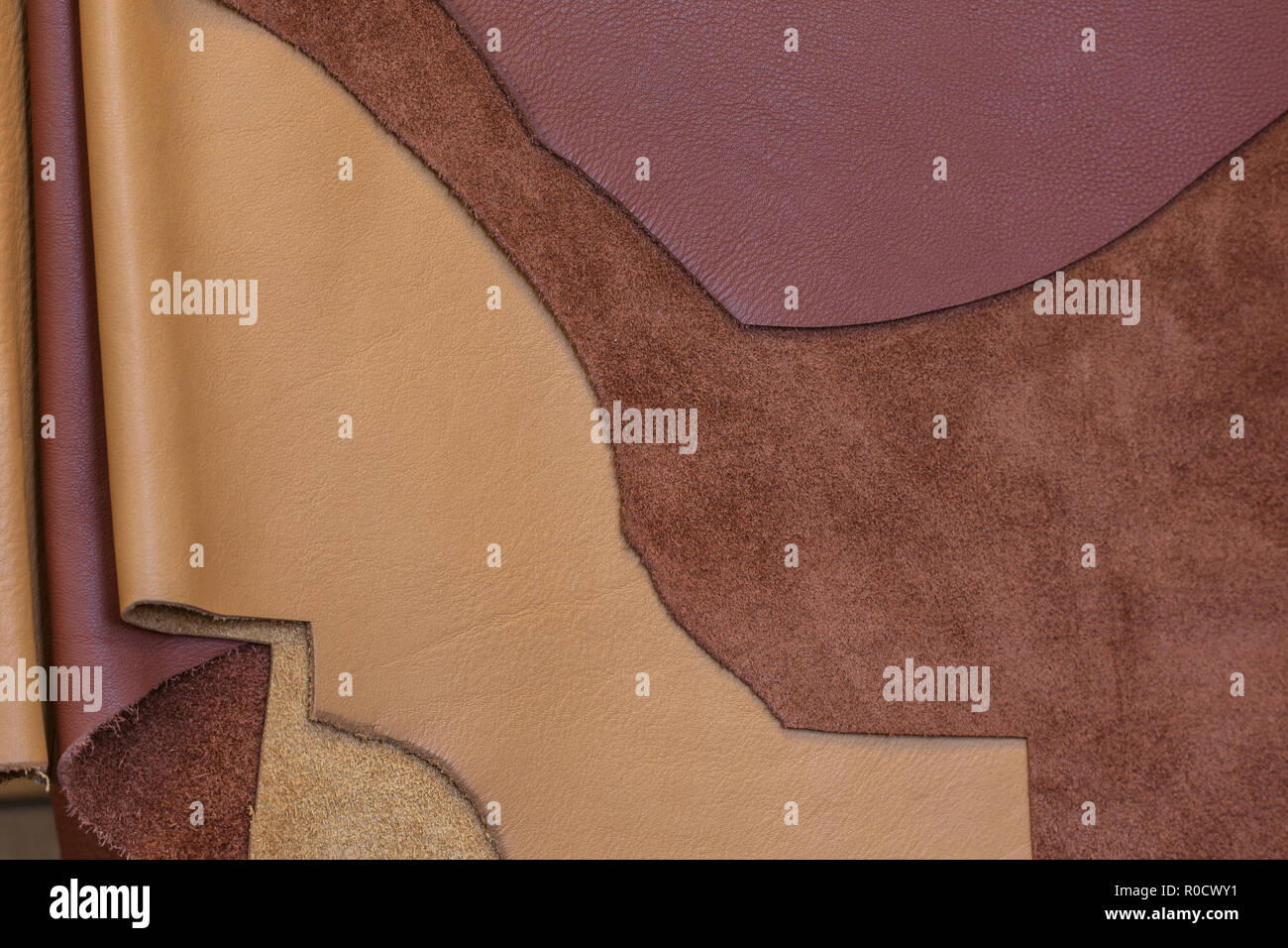 Pieces of leather in natural colors in a design workshop Stock Photo ...