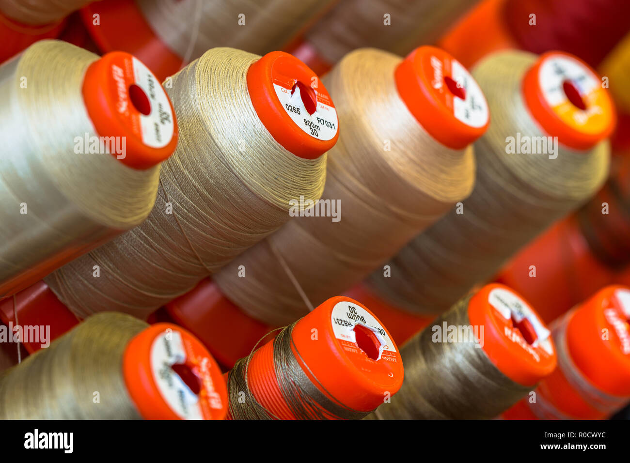 Industrial Sewing thread in a tailor workshop studio Stock Photo - Alamy