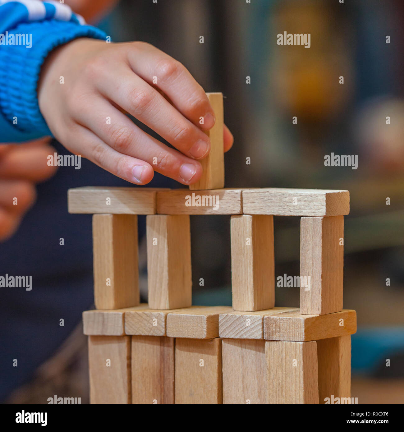 Children hands blocks hi-res stock photography and images - Alamy