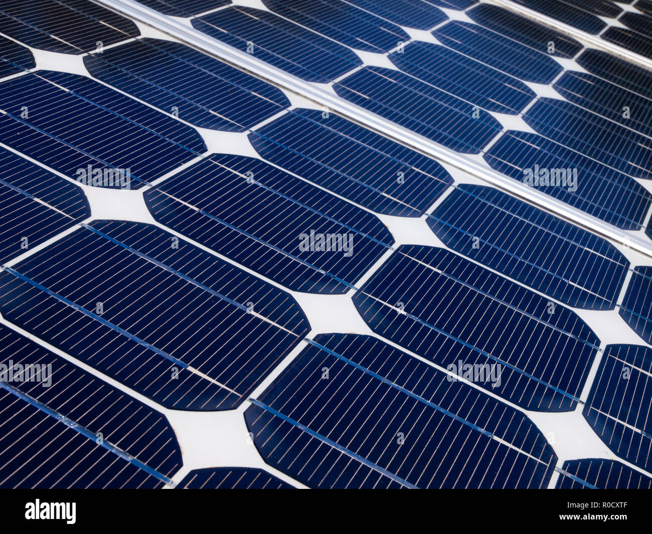 Close up of the cells of a solar panel installed on the roof of a house ...