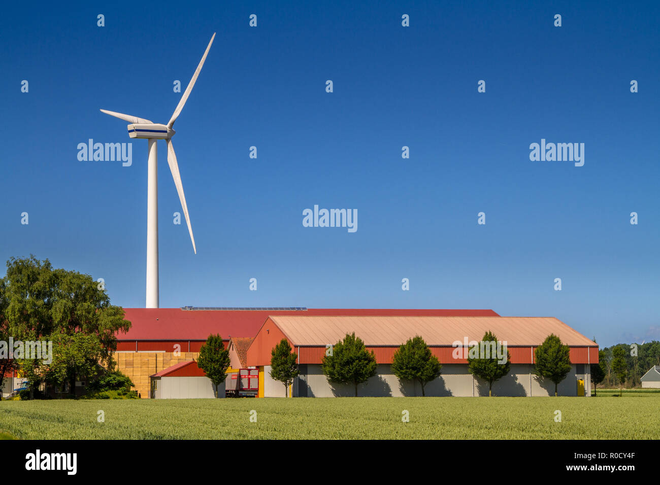 Modern Farm barns with wind turbine as an example of the new ...