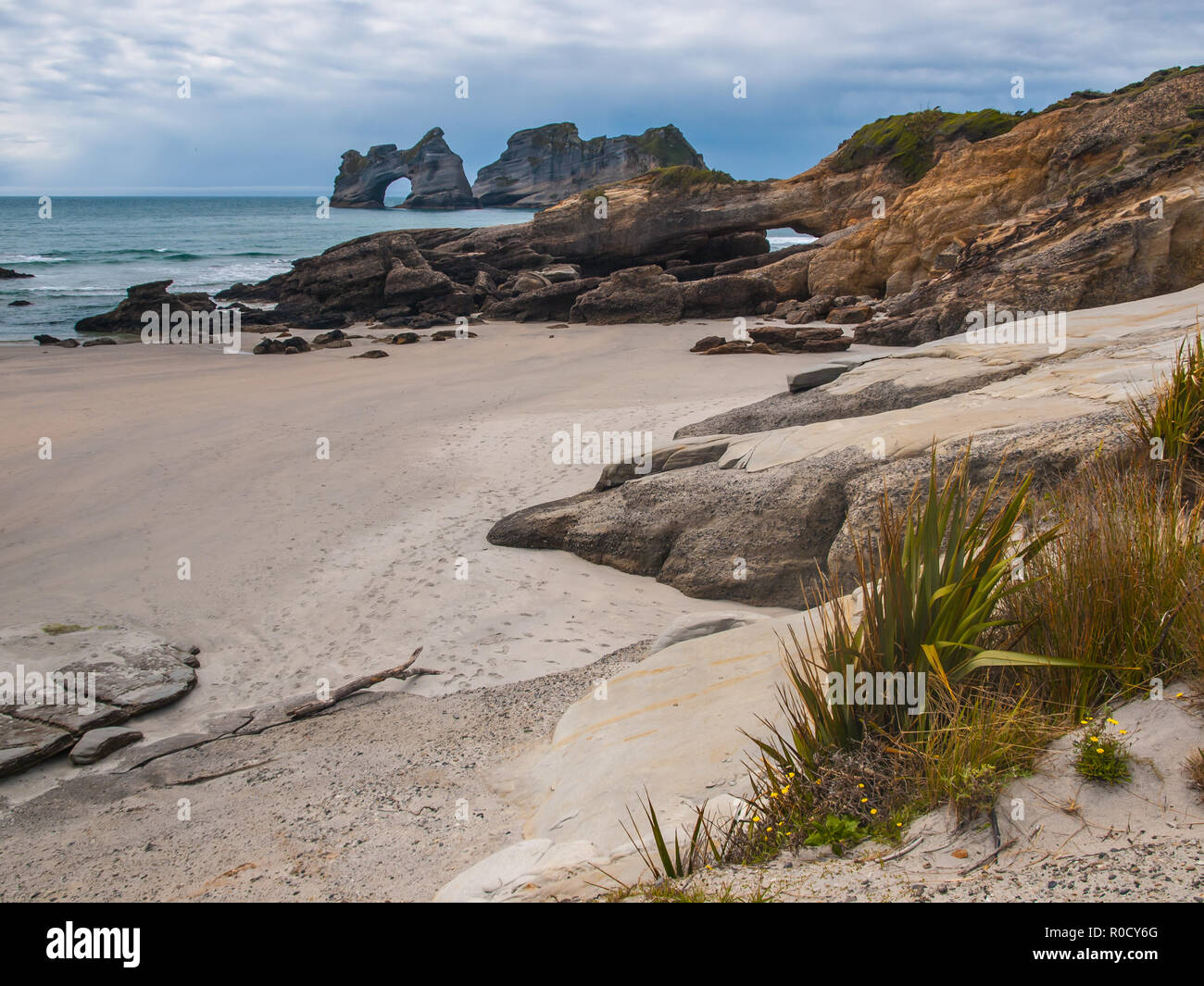 Rock island on wharariki beach hi-res stock photography and images - Alamy