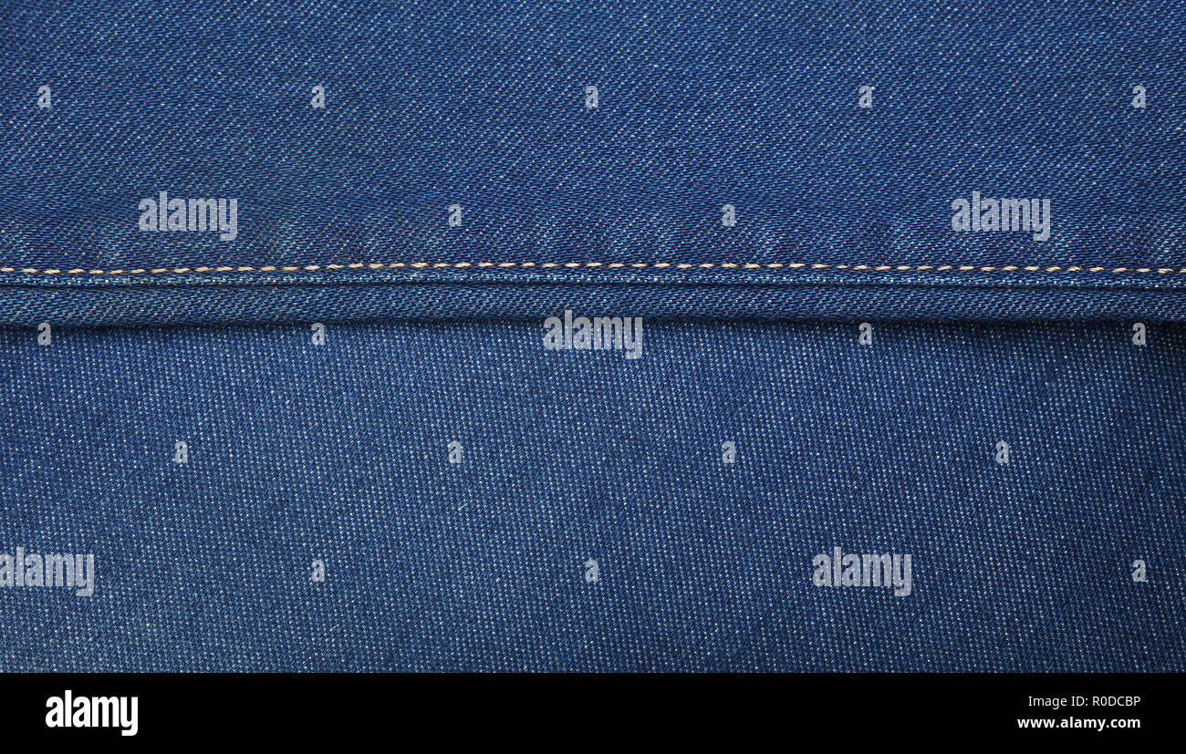 Dark indigo blue washed cotton jeans denim texture background with ...