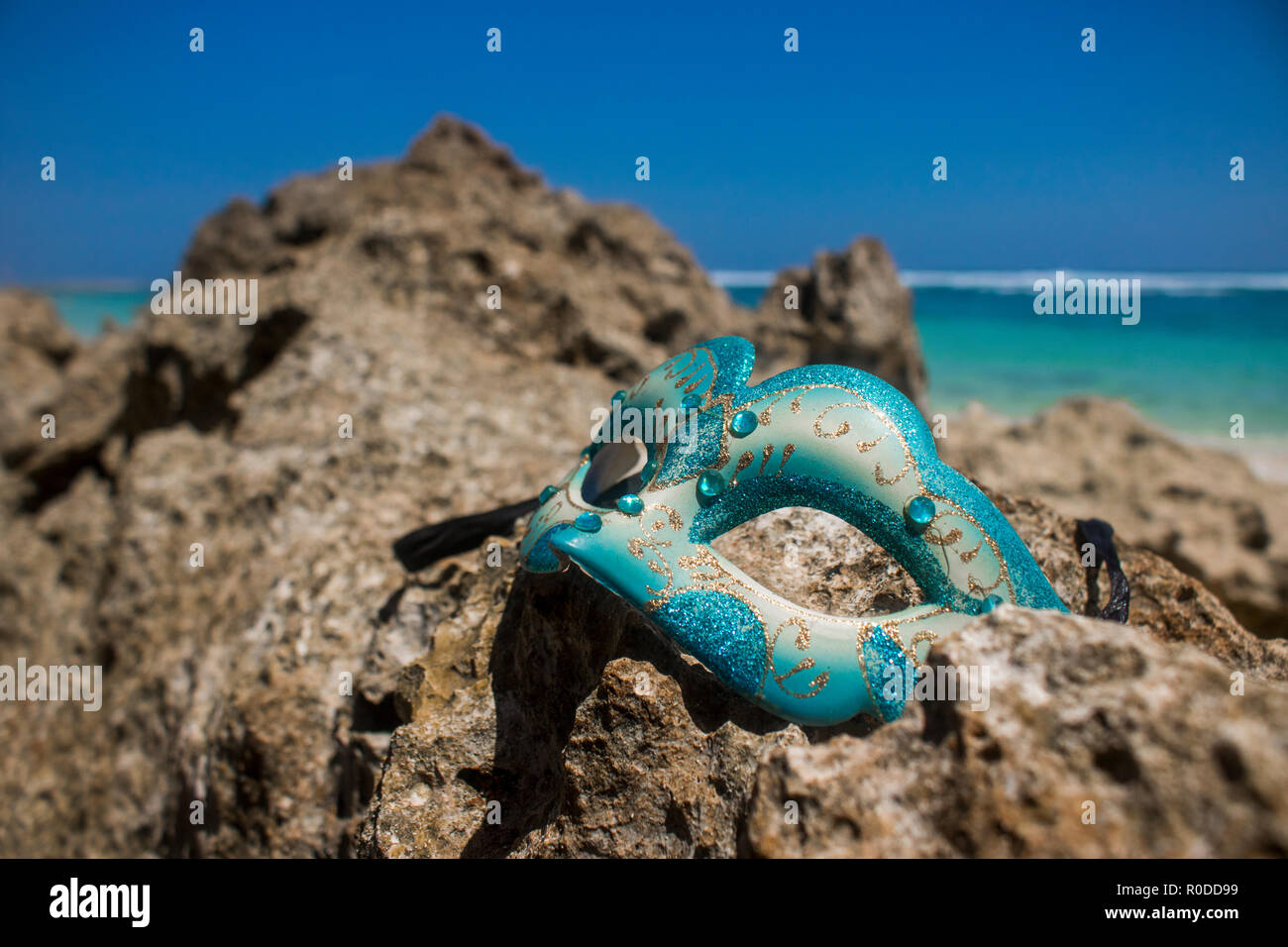 masquerade party mask on beach view photo Stock Photo - Alamy