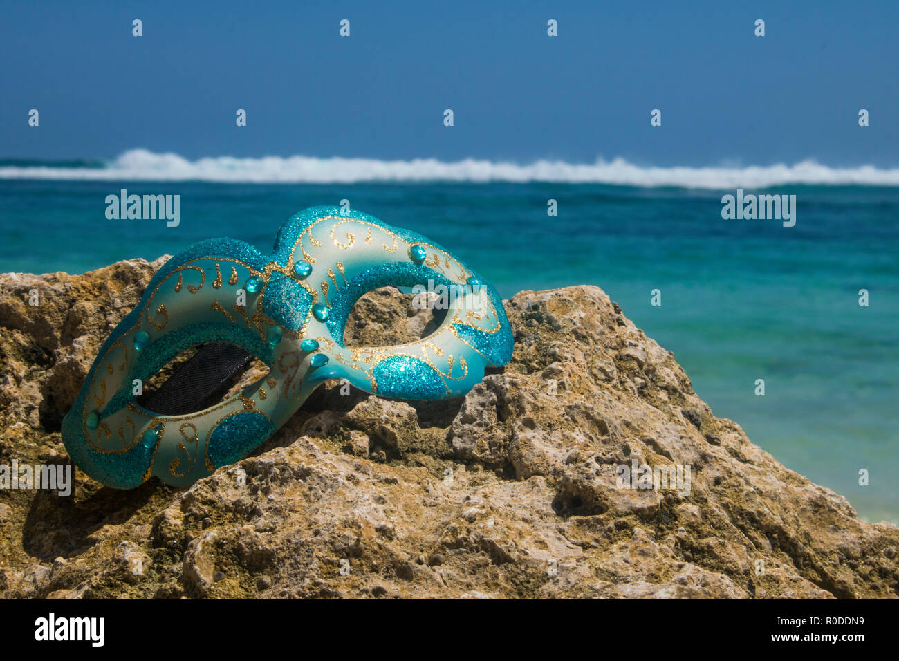 masquerade party mask on beach view photo Stock Photo - Alamy
