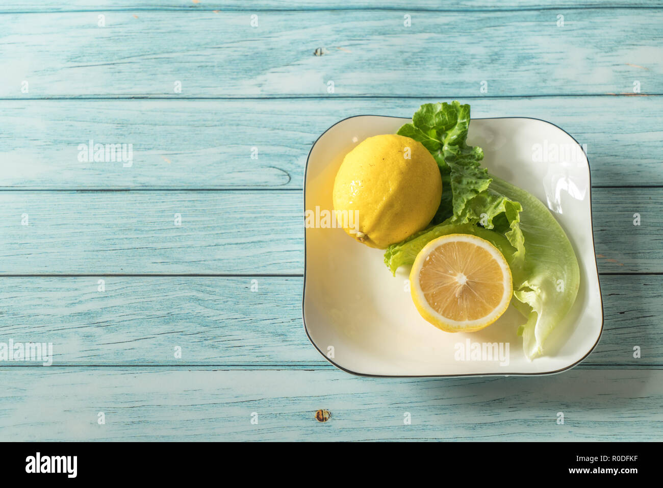 Lemon and cyan background Stock Photo - Alamy