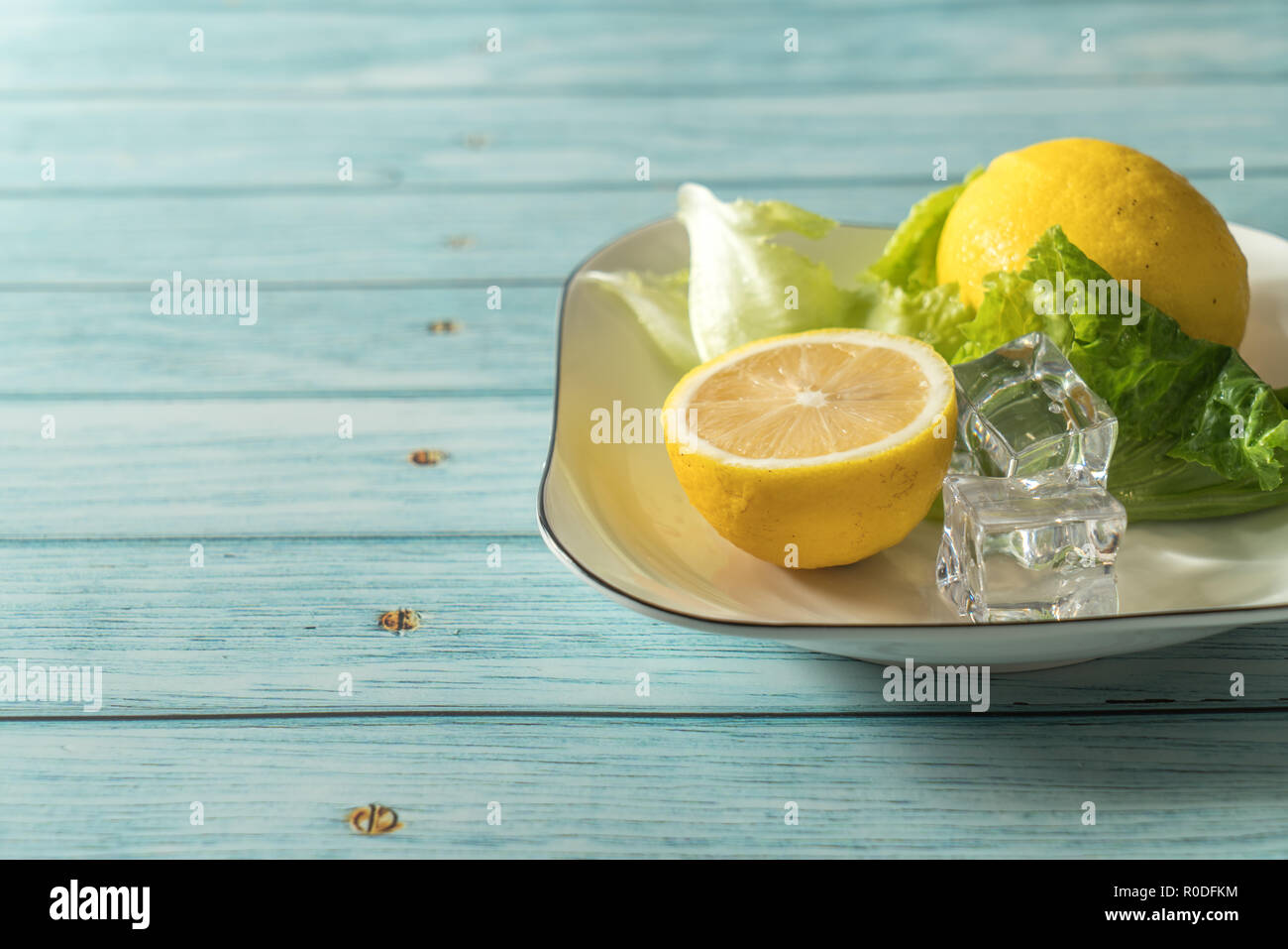 Lemon and cyan background Stock Photo - Alamy