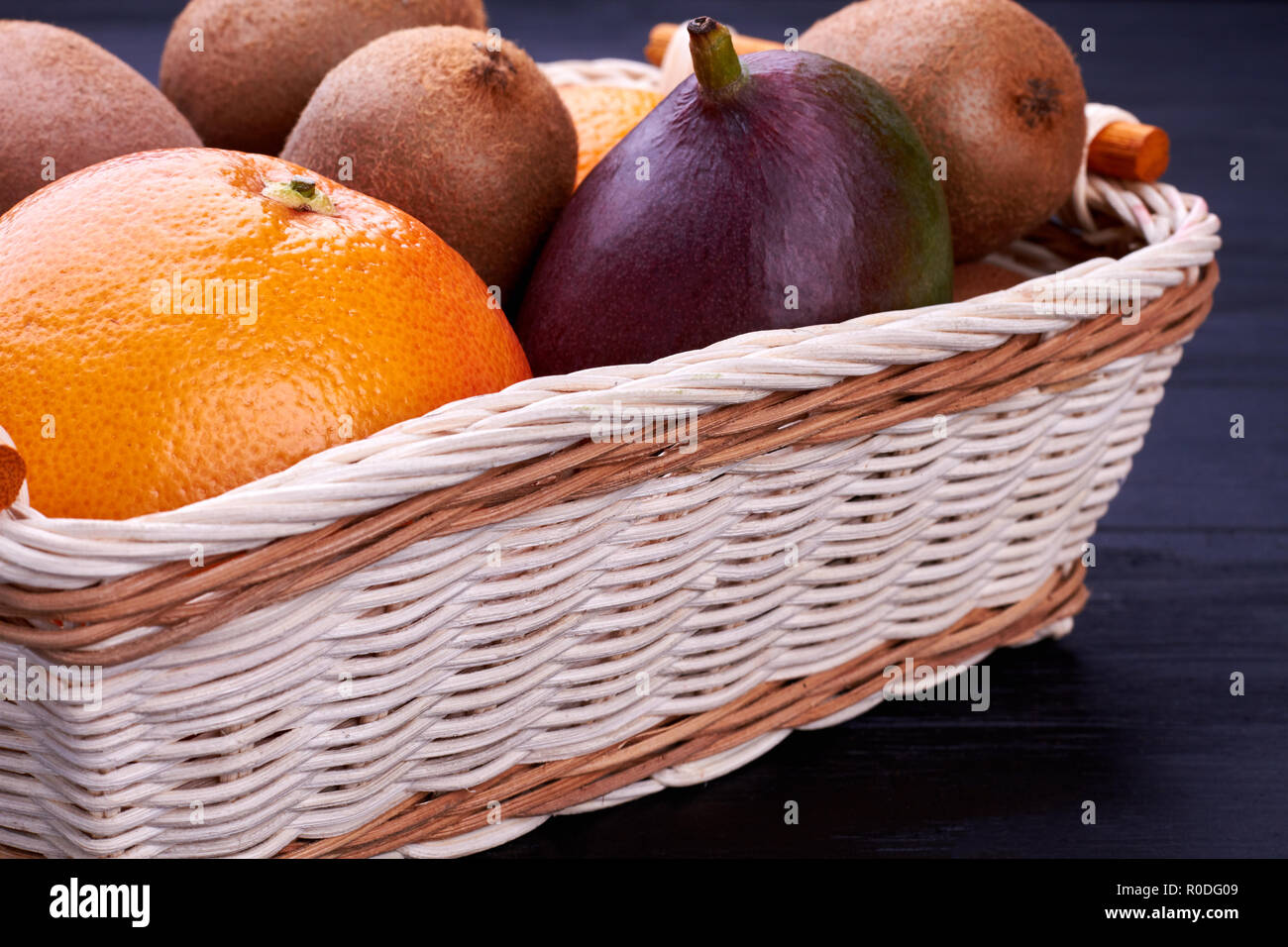 Composition with assorted fruits in wicker basket Stock Photo - Alamy