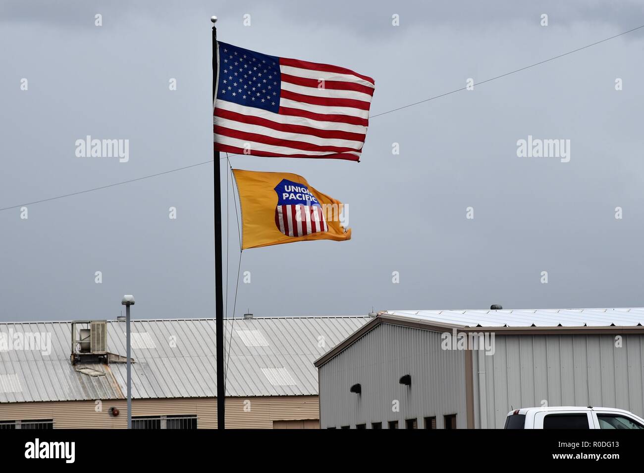 Us flag and Union Pacific flag on pole Stock Photo - Alamy