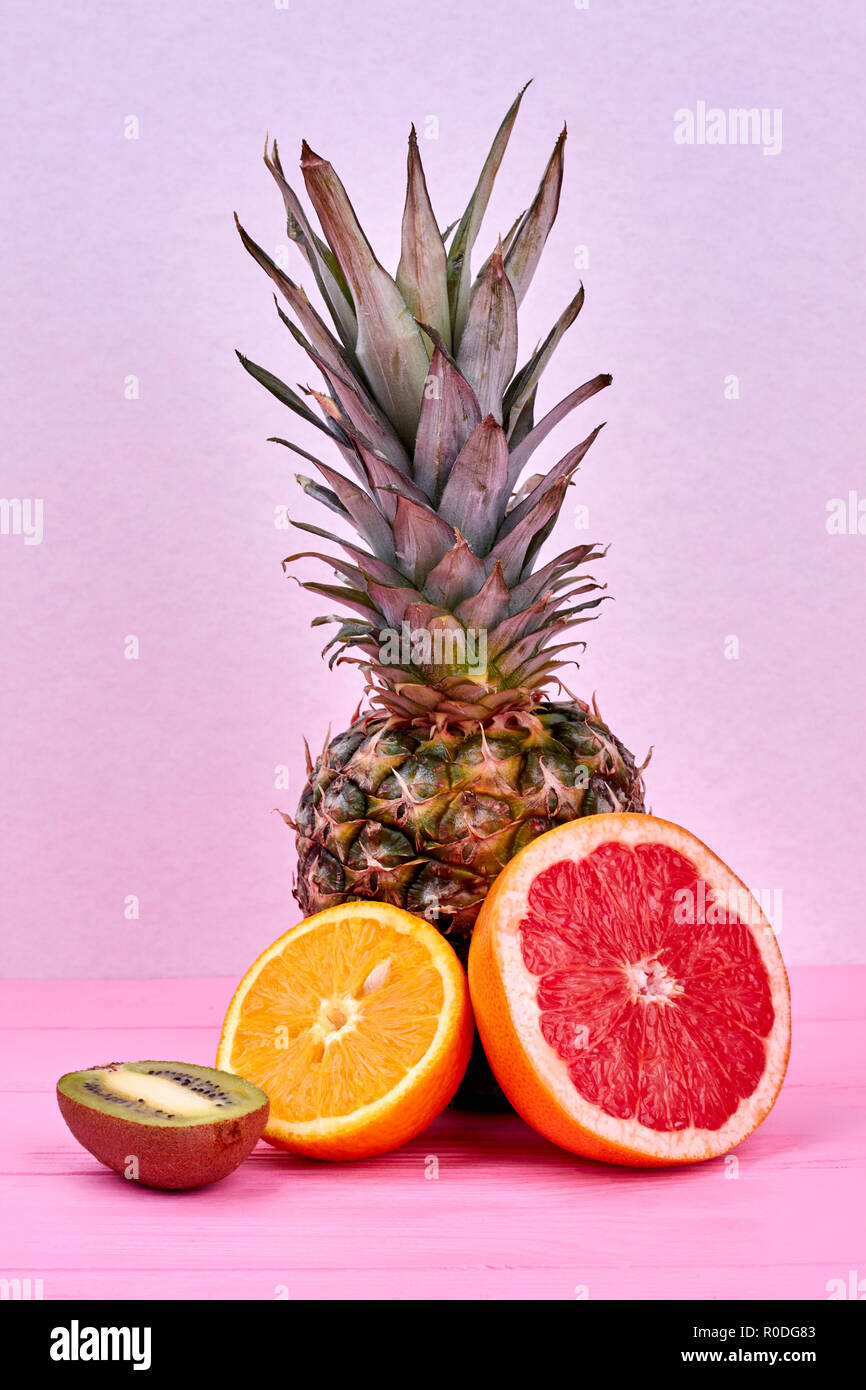 Composition from exotic fruits on colorful background Stock Photo - Alamy