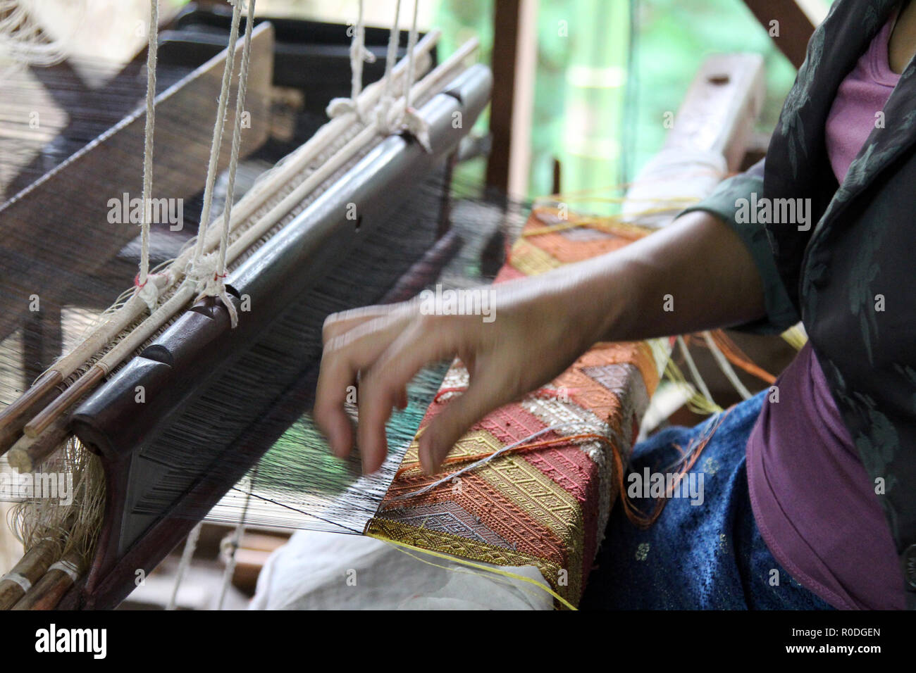 Woman weaving textile on hi-res stock photography and images - Alamy