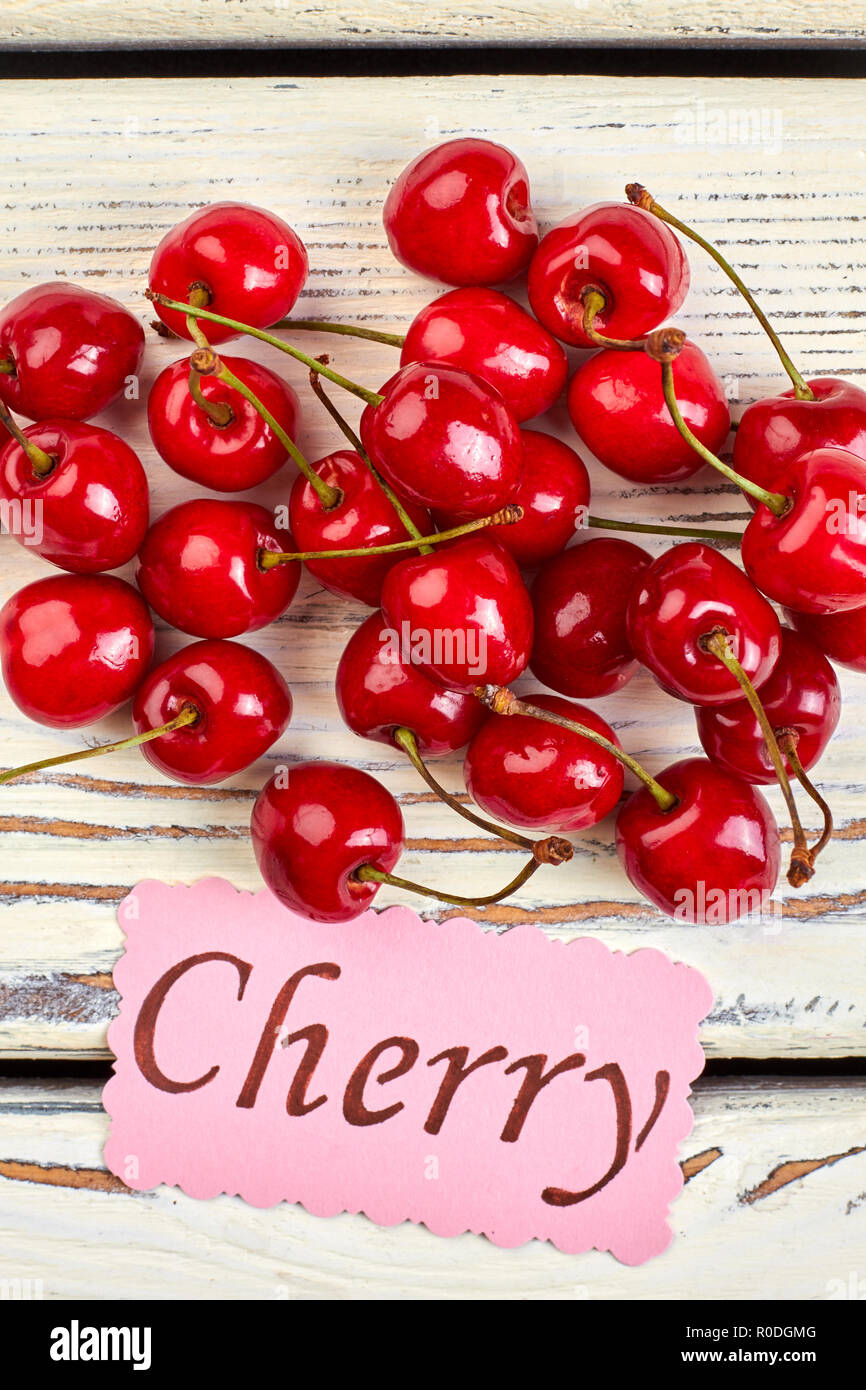 Pile of red cherries and paper card Stock Photo - Alamy