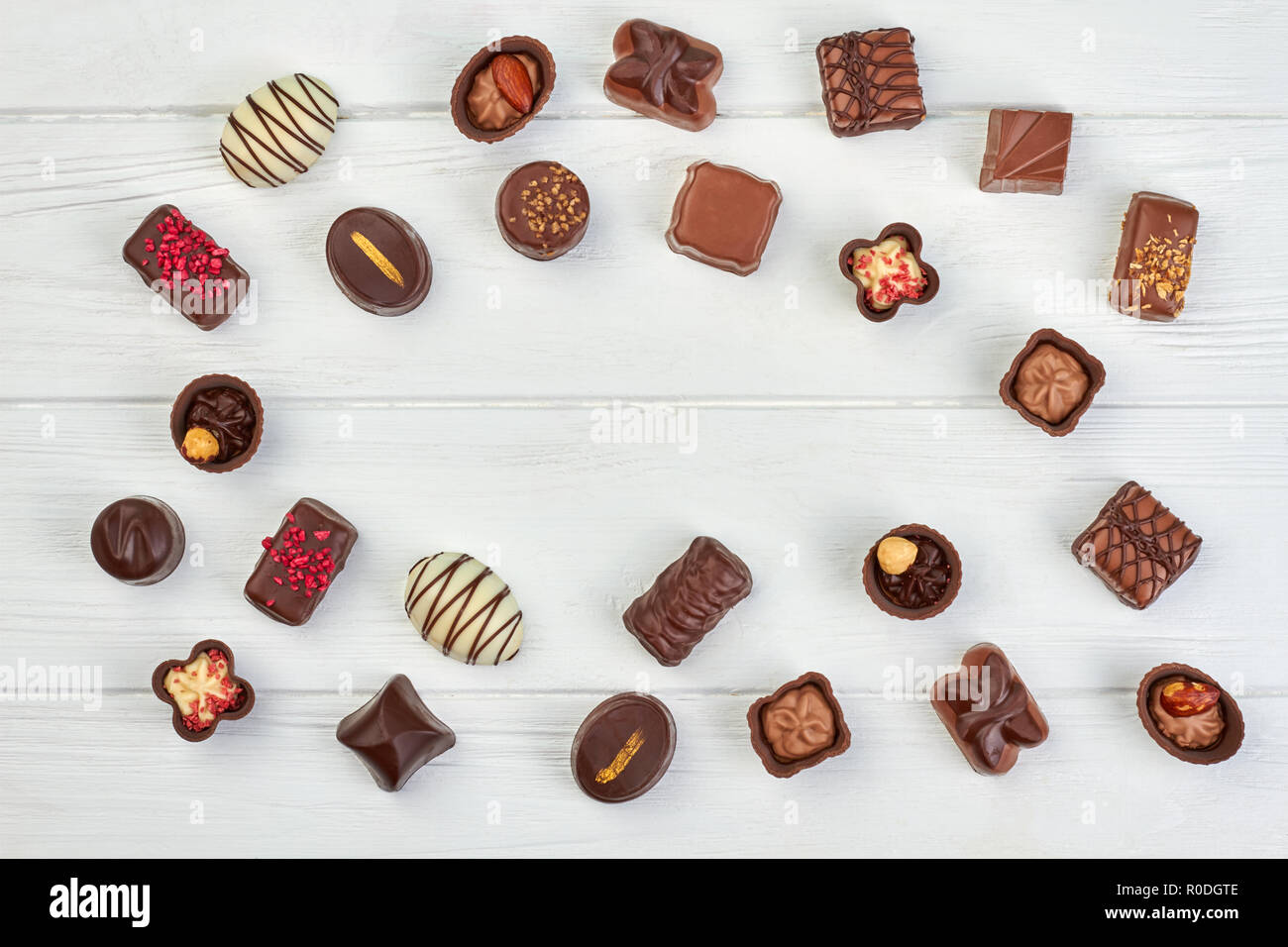 Frame from chocolate candies on white background Stock Photo - Alamy