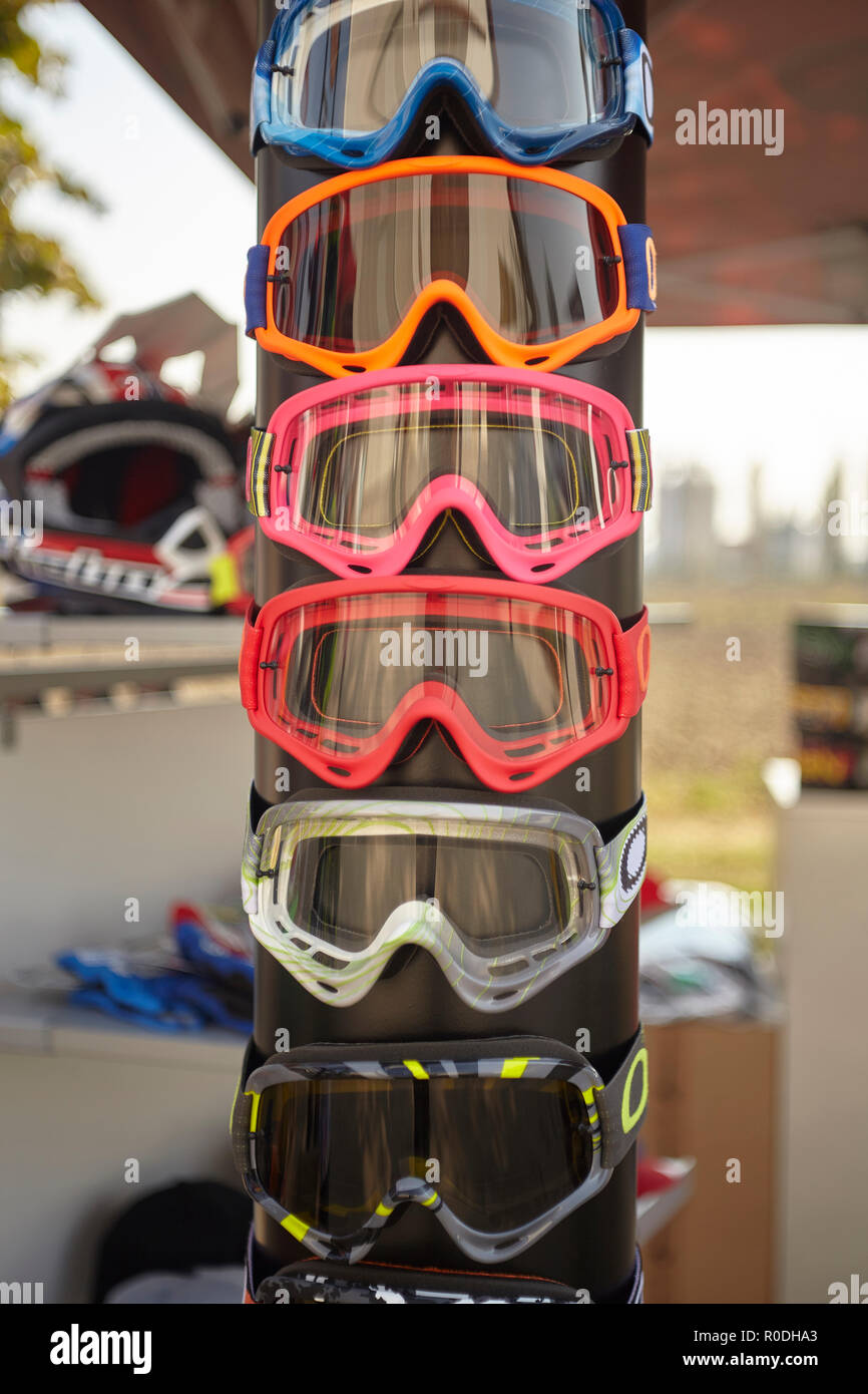 Display of colored motocross spectacles and different models at a fair ...