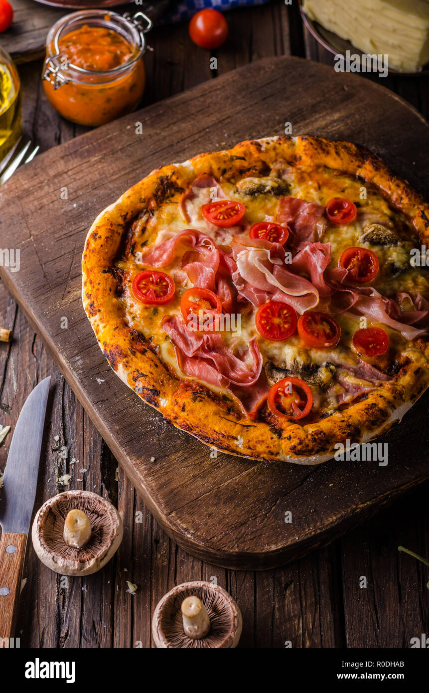 Rustic old style vintage pizza, wood board, fresh food Stock Photo - Alamy