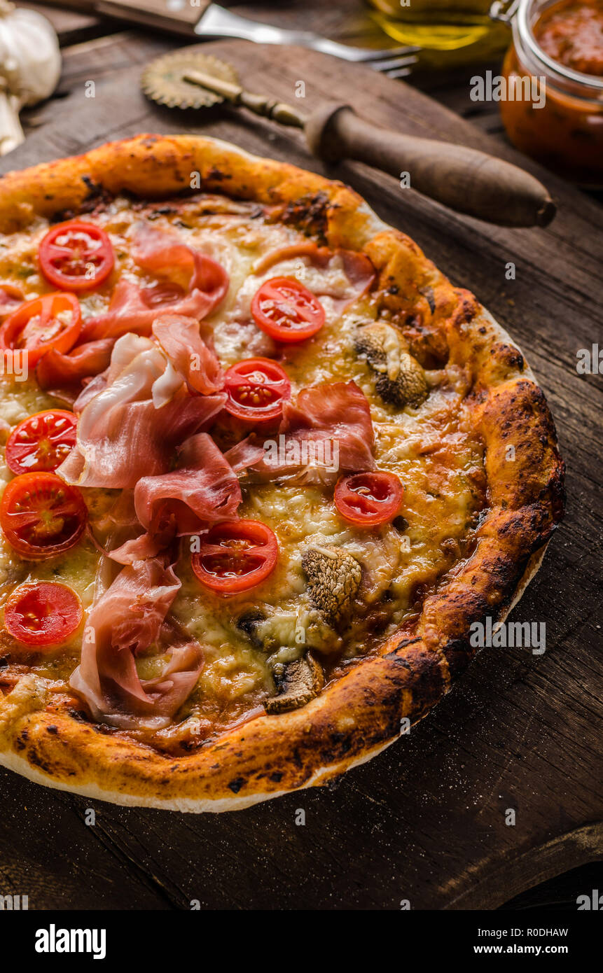 Rustic old style vintage pizza, wood board, fresh food Stock Photo - Alamy