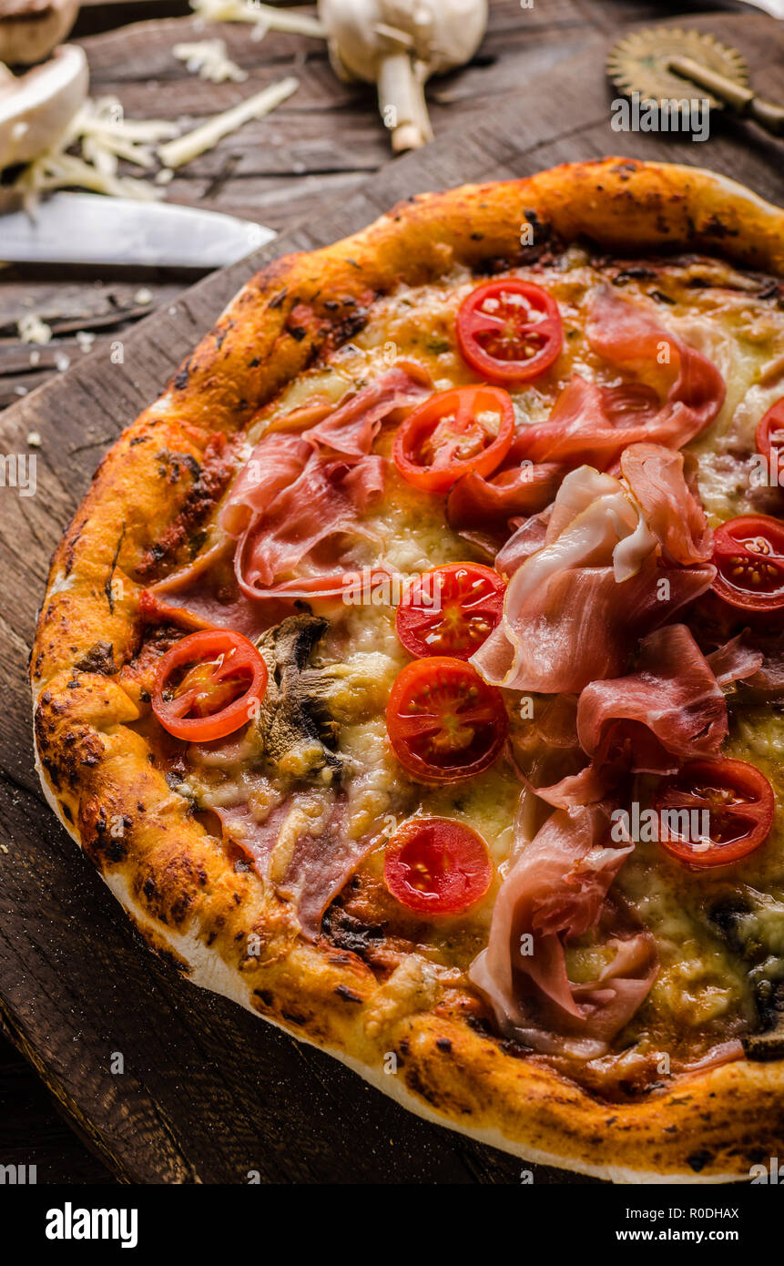 Rustic old style vintage pizza, wood board, fresh food Stock Photo - Alamy