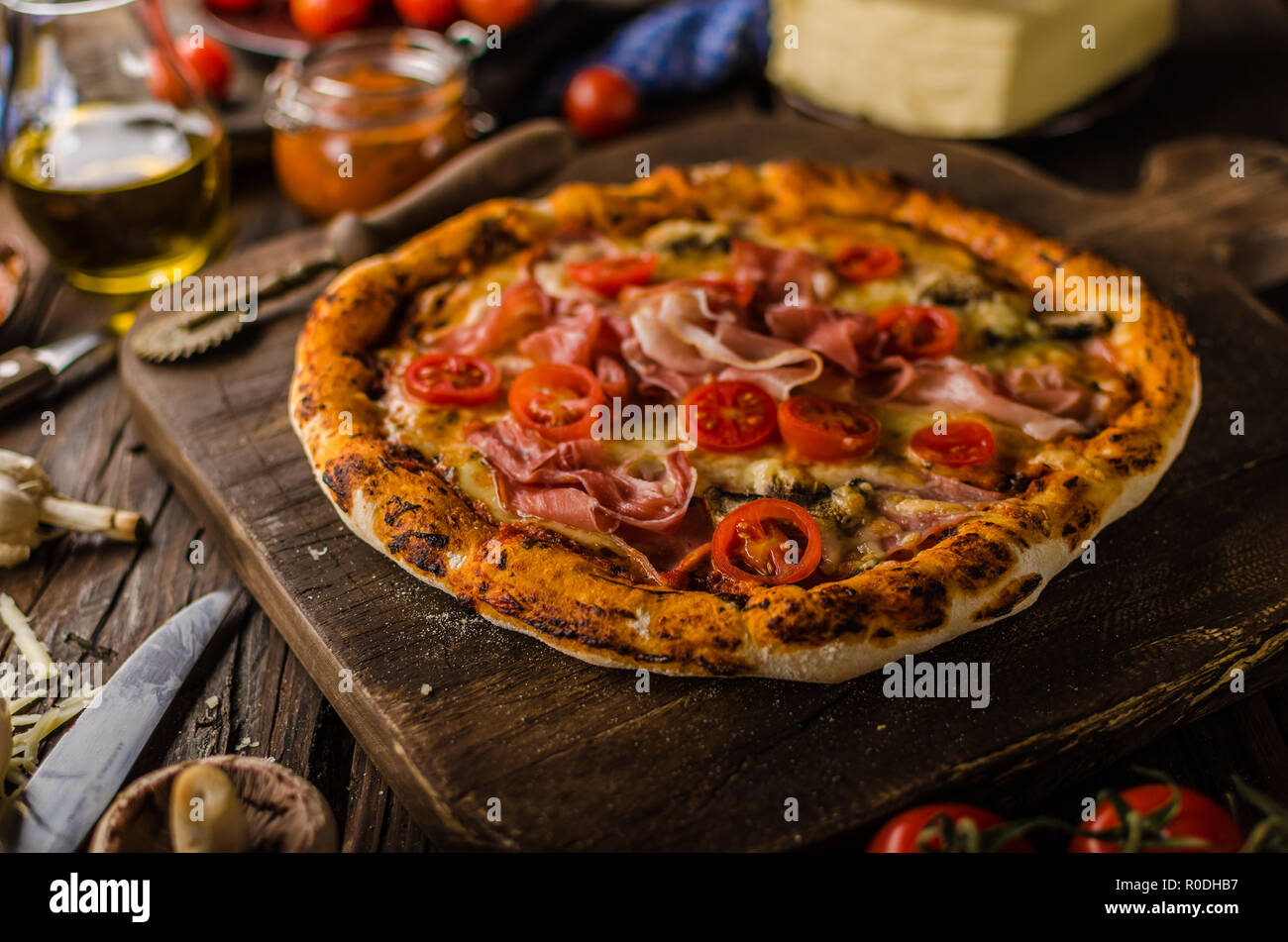 Rustic old style vintage pizza, wood board, fresh food Stock Photo - Alamy