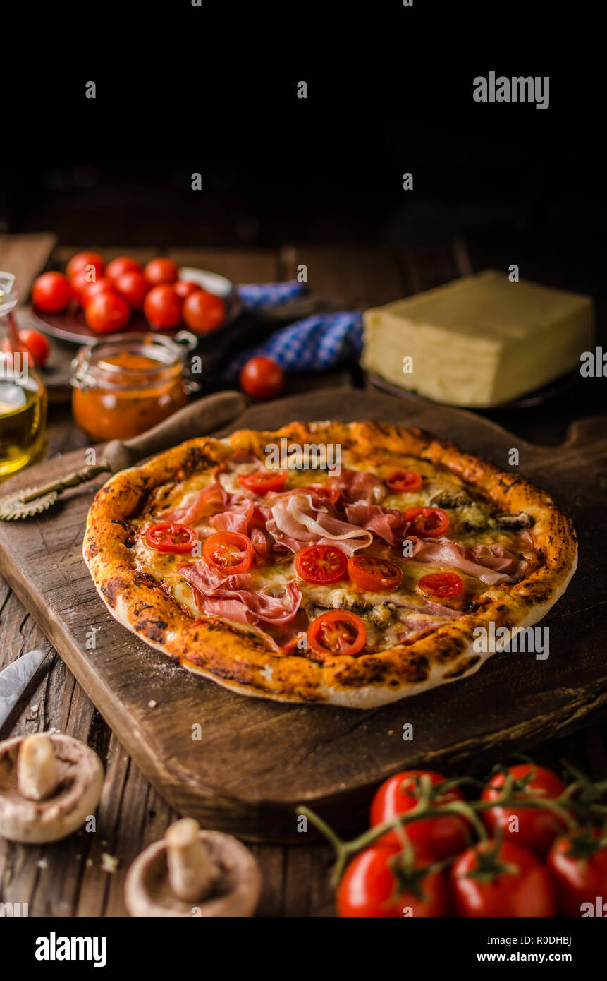 Rustic old style vintage pizza, wood board, fresh food Stock Photo - Alamy