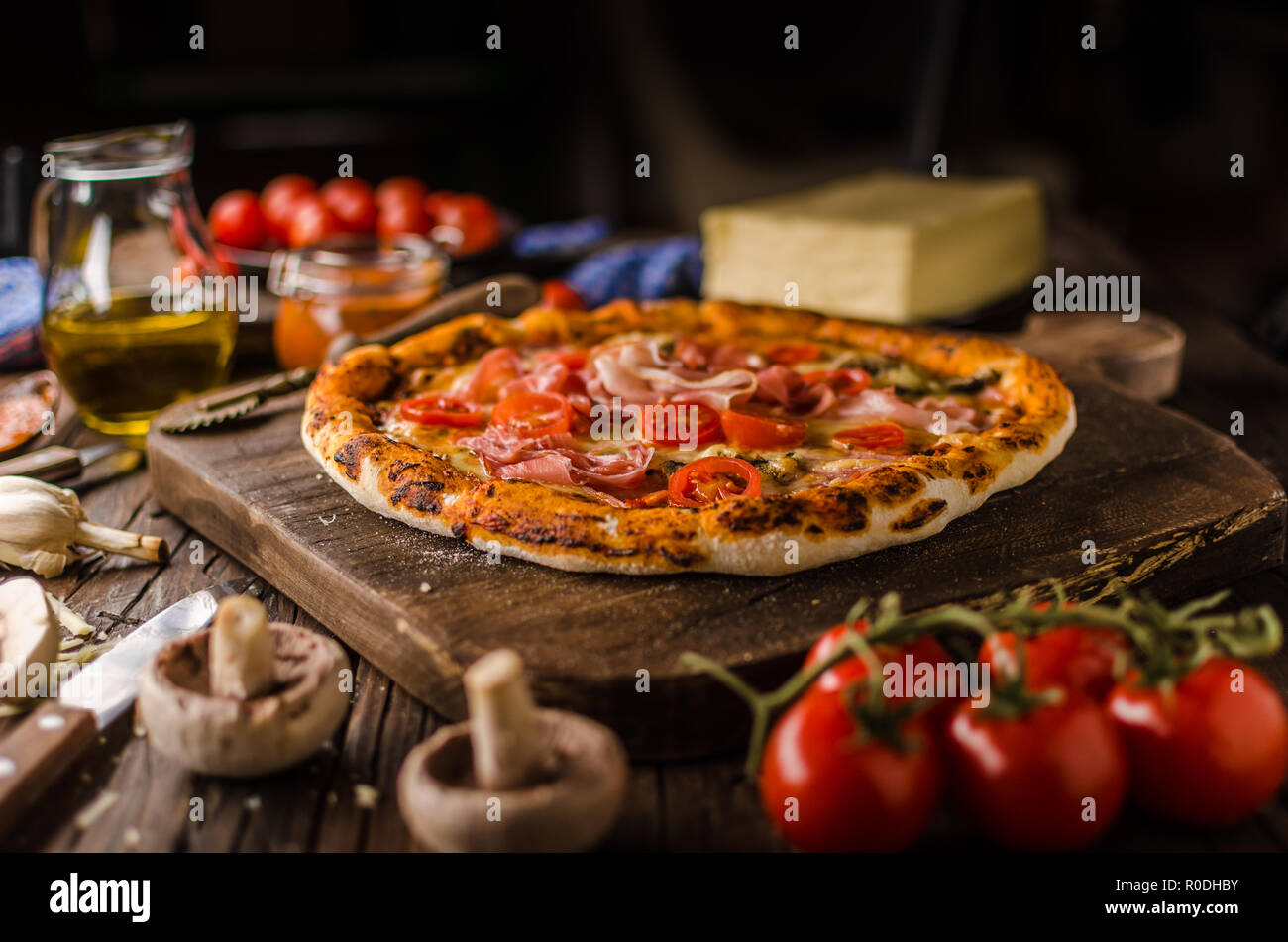 Rustic old style vintage pizza, wood board, fresh food Stock Photo - Alamy