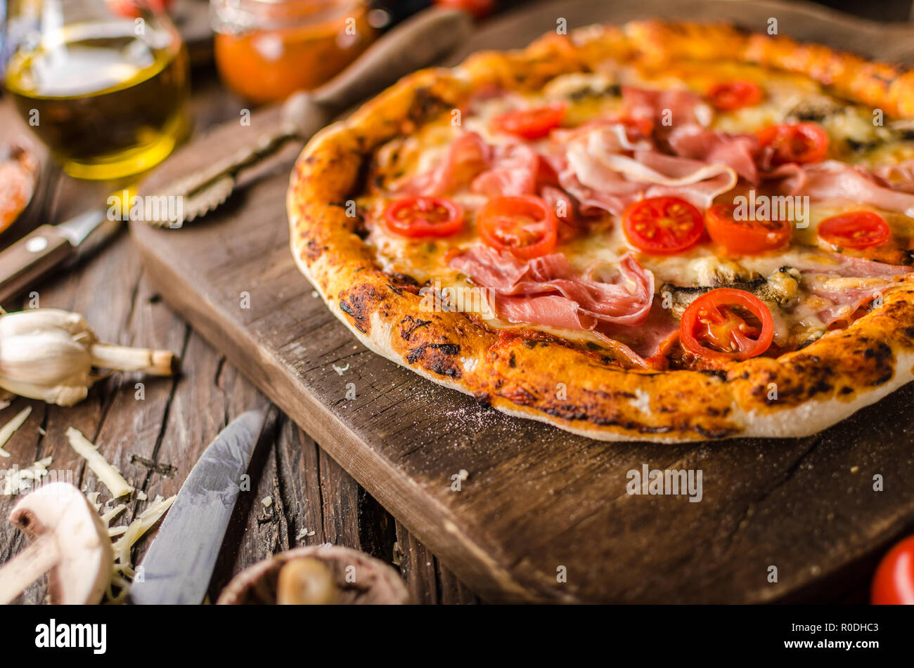 Rustic old style vintage pizza, wood board, fresh food Stock Photo - Alamy