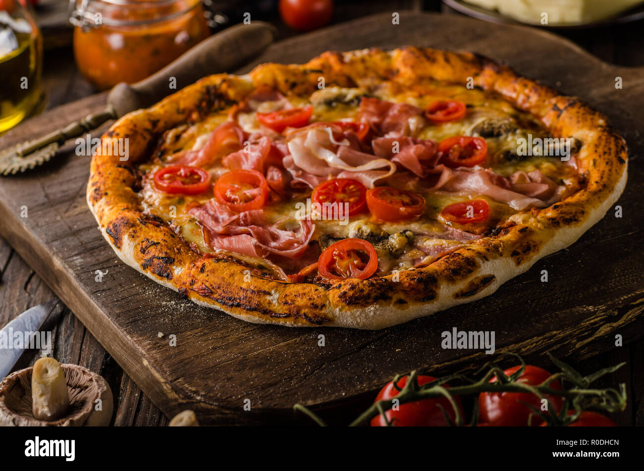 Rustic old style vintage pizza, wood board, fresh food Stock Photo - Alamy