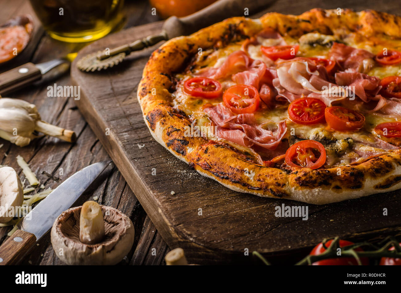 Rustic old style vintage pizza, wood board, fresh food Stock Photo - Alamy