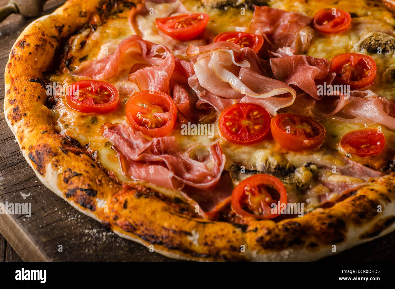 Rustic old style vintage pizza, wood board, fresh food Stock Photo - Alamy
