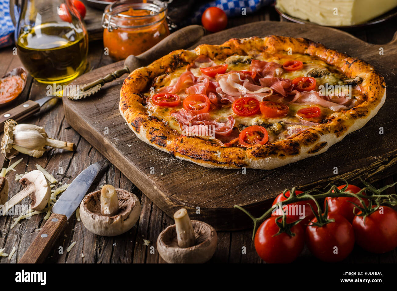 Rustic old style vintage pizza, wood board, fresh food Stock Photo - Alamy