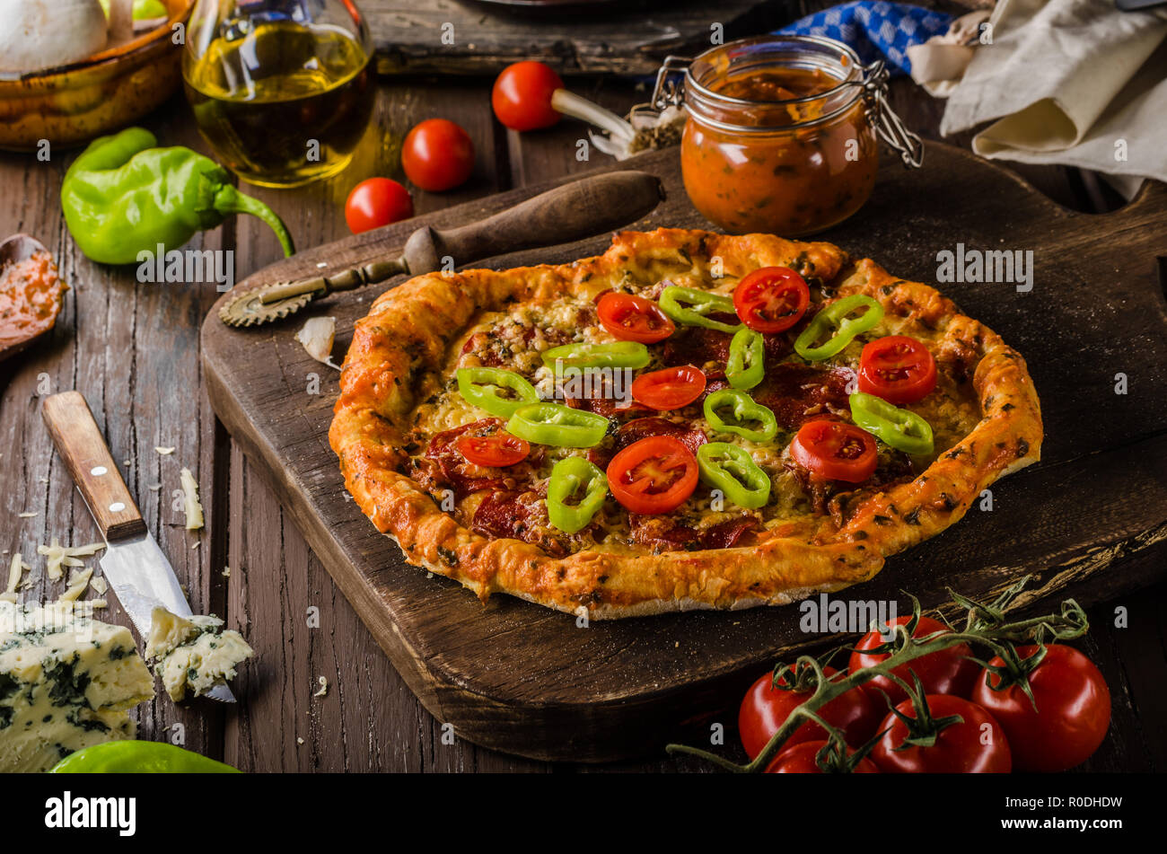 Rustic old style vintage pizza, wood board, fresh food Stock Photo - Alamy