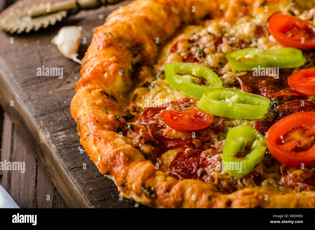 Rustic old style vintage pizza, wood board, fresh food Stock Photo - Alamy