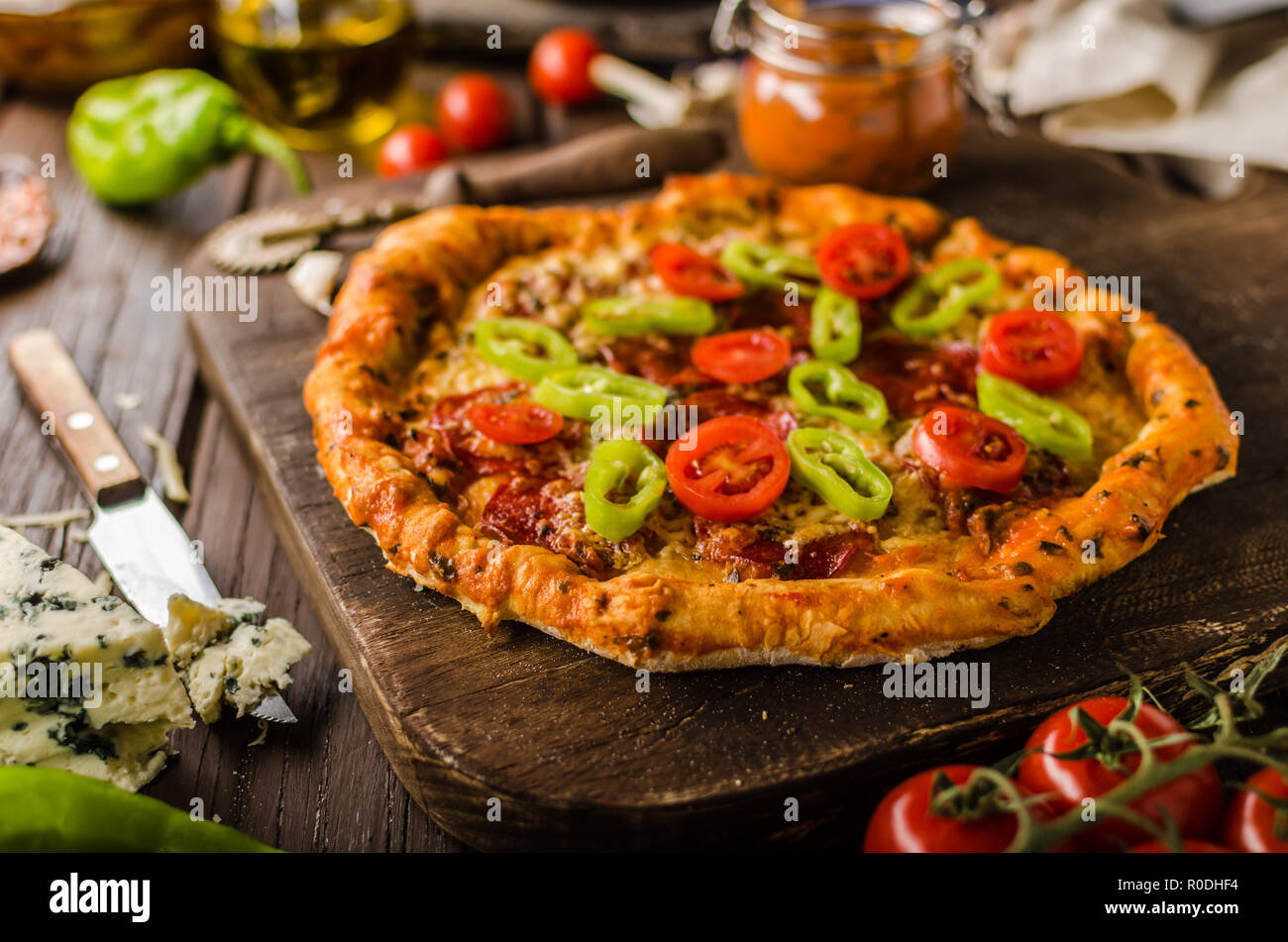 Rustic old style vintage pizza, wood board, fresh food Stock Photo - Alamy