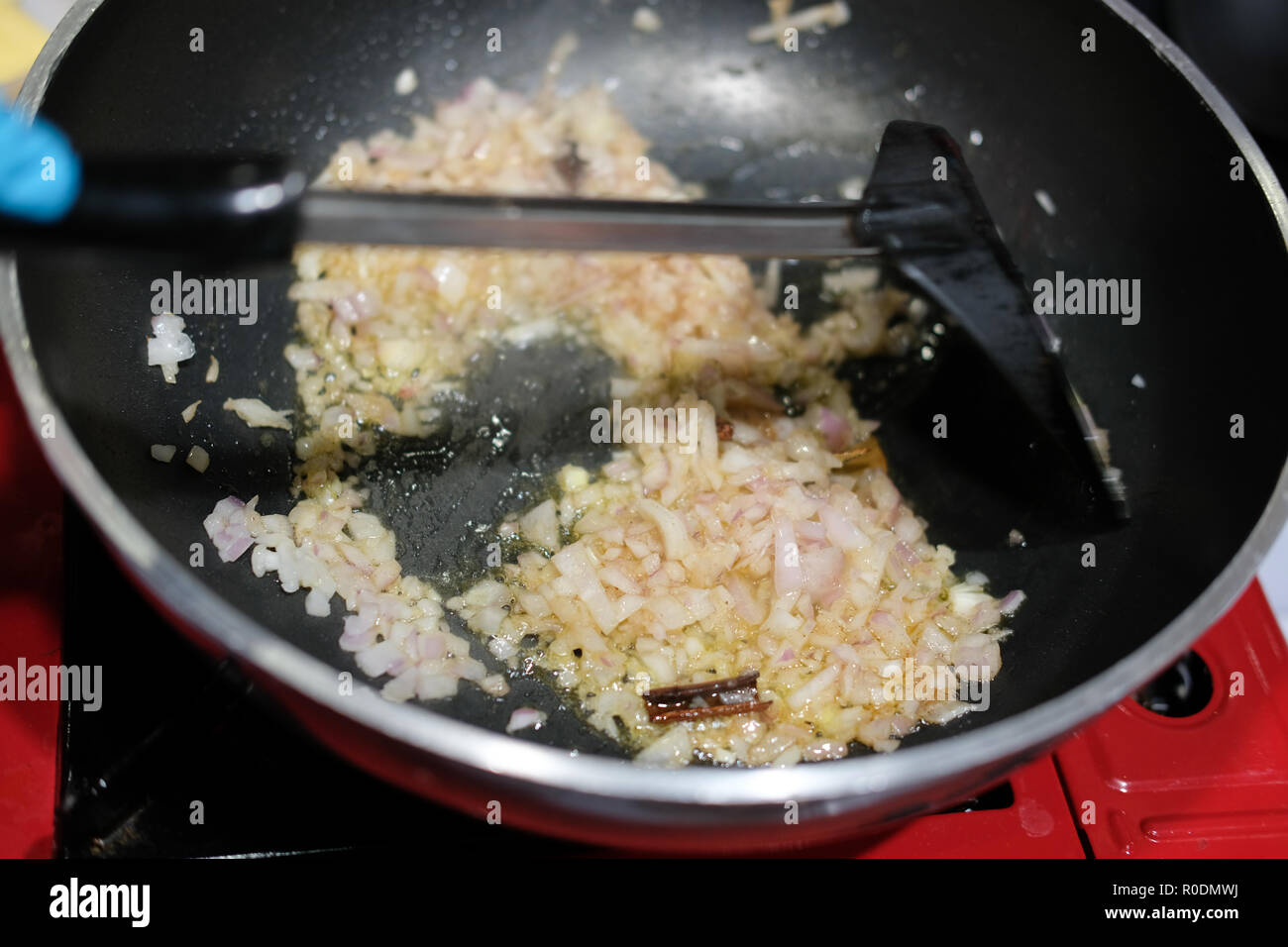 chef cooking onion & spices indian food in a pan Stock Photo - Alamy