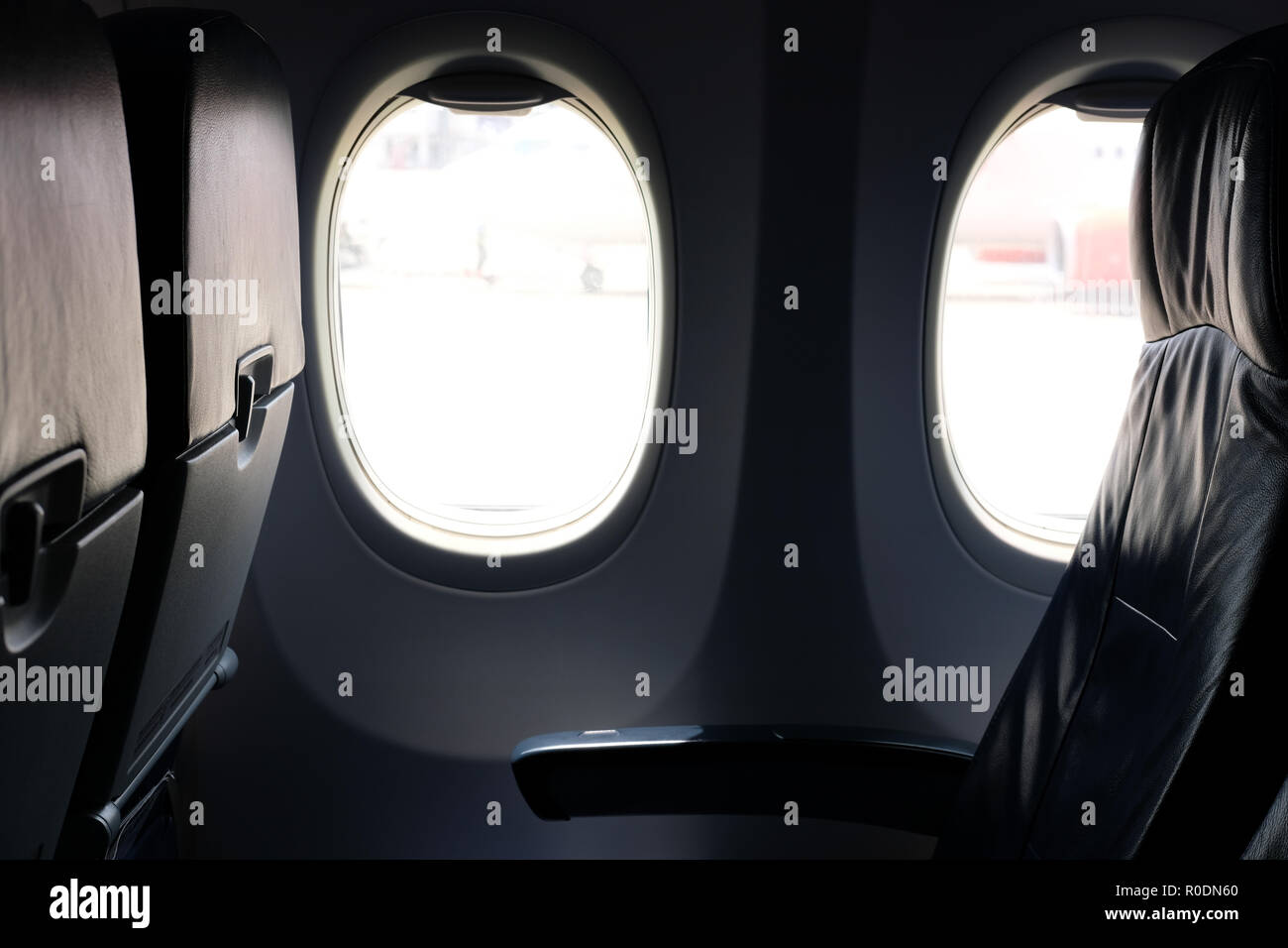 airplane window inside cabin. aircraft porthole opening Stock Photo - Alamy