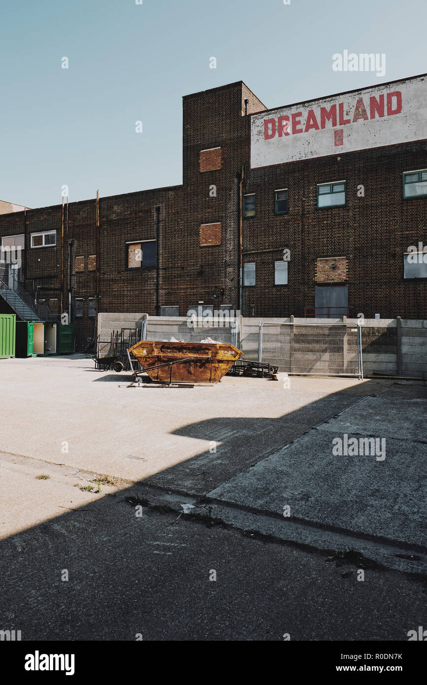 Dreamland Welcomes You - a run down urban backyard with a waste skip ...