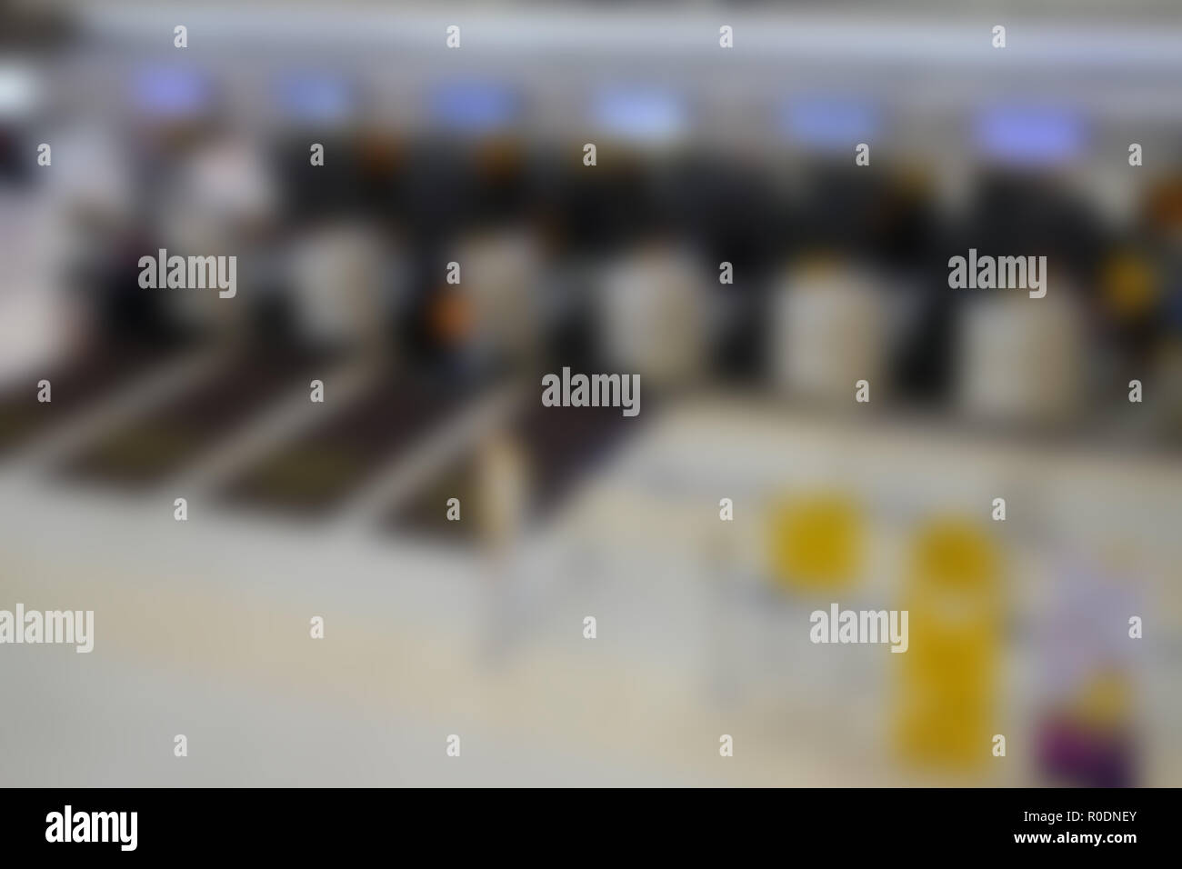 check in desk counter in airport terminal. defocused blur background ...