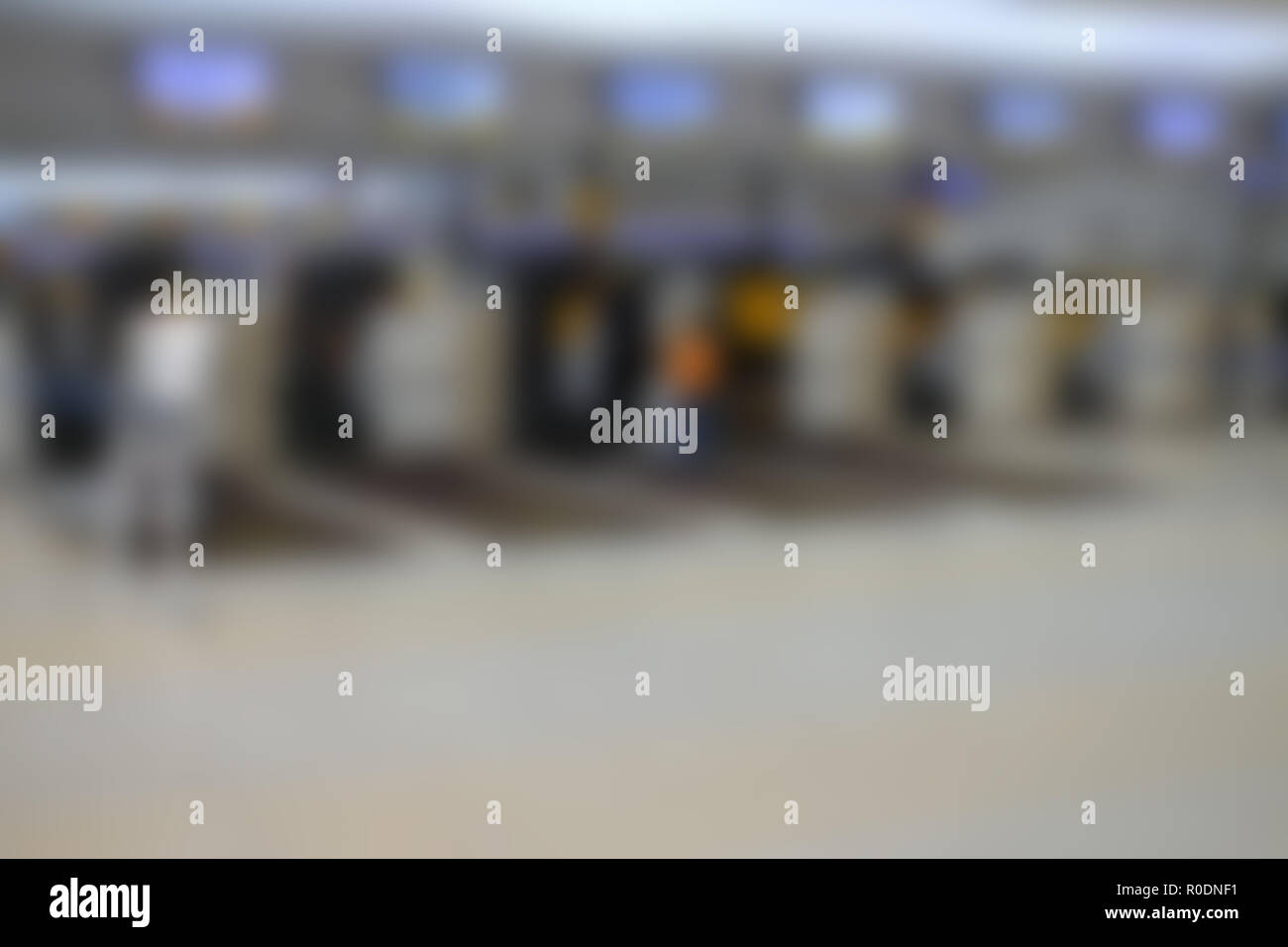 check in desk counter in airport terminal. defocused blur background ...
