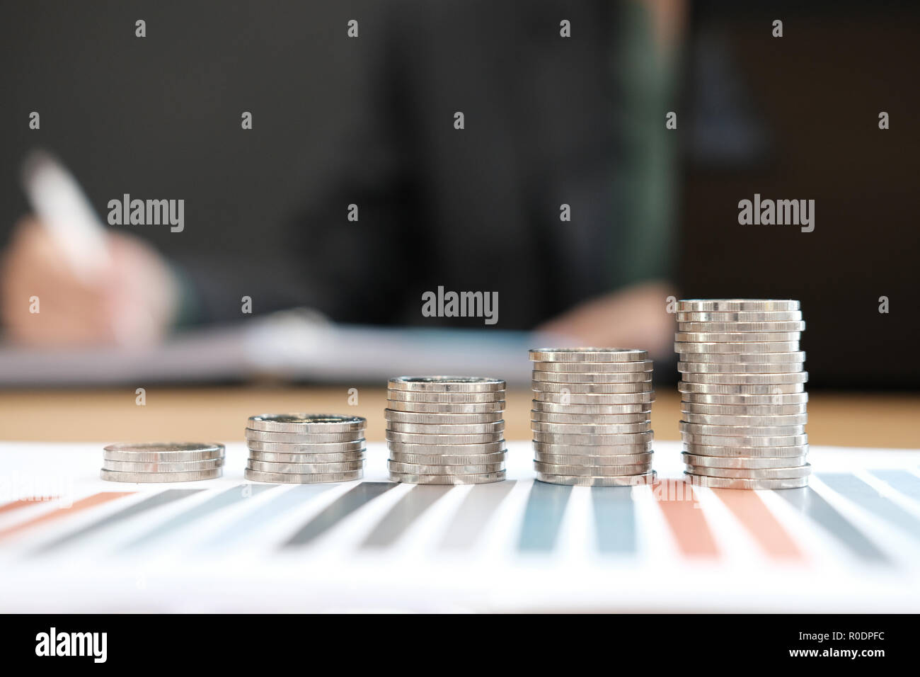 coins stack & business growth. businessman working at workplace Stock ...