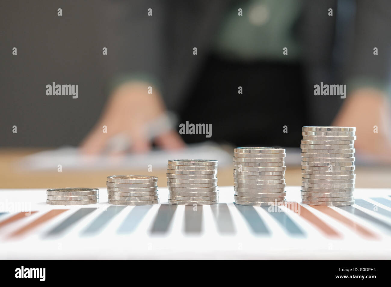 coins stack & business growth. businessman working at workplace Stock ...