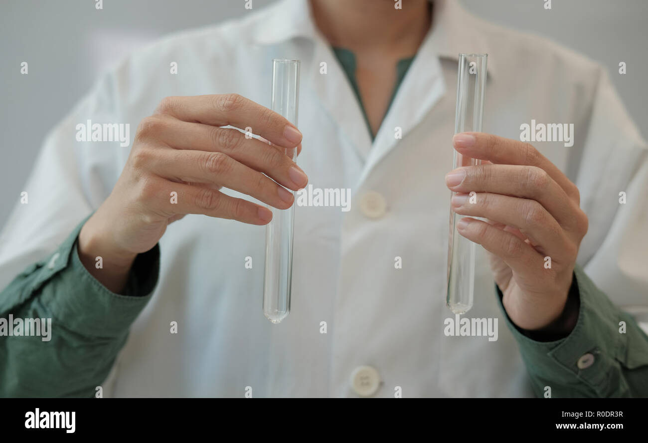 scientist working with test tube. researcher doing research ...