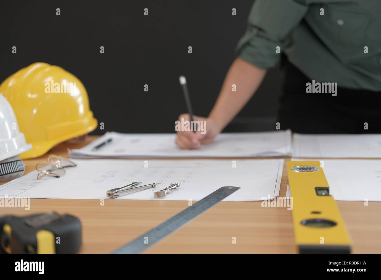 architect engineer working on house blueprint of real estate project at ...